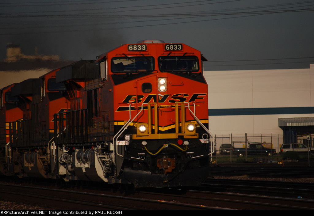 A Very, Very Clean and Brand New BNSF 6833 Fresh out of GE Erie, PA!!! Leads a Hot Stack Train ...
